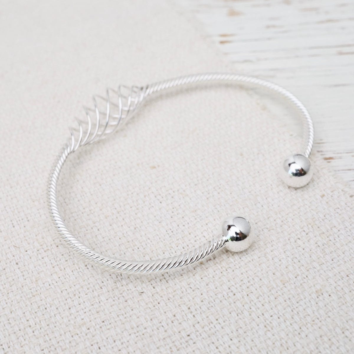 Sterling Silver Twisted Wire Cuff with Center Twirl – Dandelion Jewelry